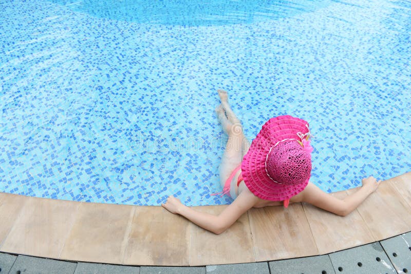 Enjoying a swimming pool stock photo. Image of leisure - 32191382