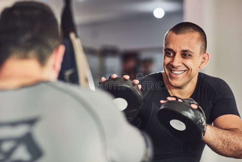 Enjoying the Training Session. Two Professional Fighters Sparring in ...