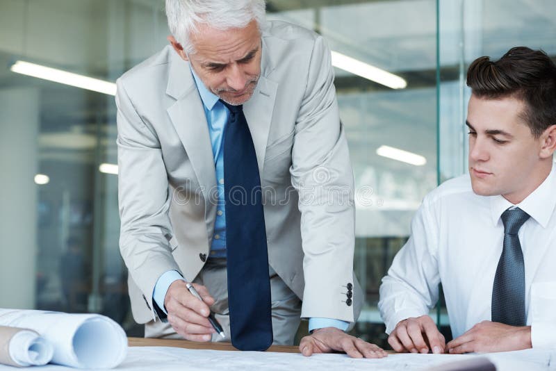 Ensuring the Blueprints are Perfect. Two Architects Going Over a ...