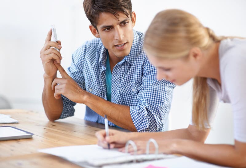 Ensuring Their Contracts are in Order. Two Young Entrepreneurs Looking ...
