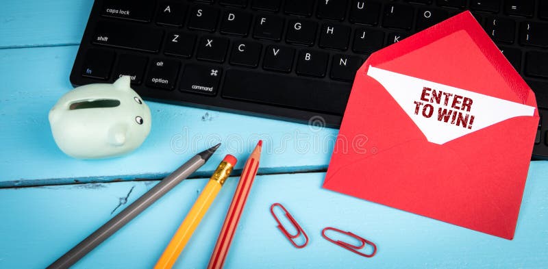 Enter To Win. Computer Keyboard on a Blue Office Table Stock Image ...