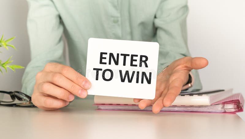 Enter To Win Text on Notepad in Hands, Concept Background Stock Image ...