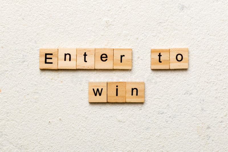 Enter To Win Word Written on Wood Block. Enter To Win Text on Cement ...