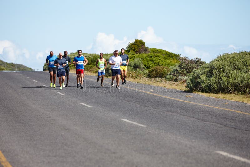 They Entered this Marathon To Challenge Themselves. Shot of a Group of ...