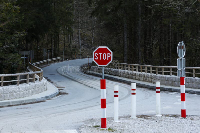At the Crossroads, before the Exit Onto a Winding Mountain-forest Road ...