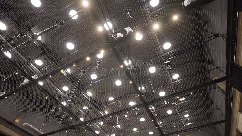 Entering Empty Theater Hall with a View on Tension Wire Grid Ceiling ...
