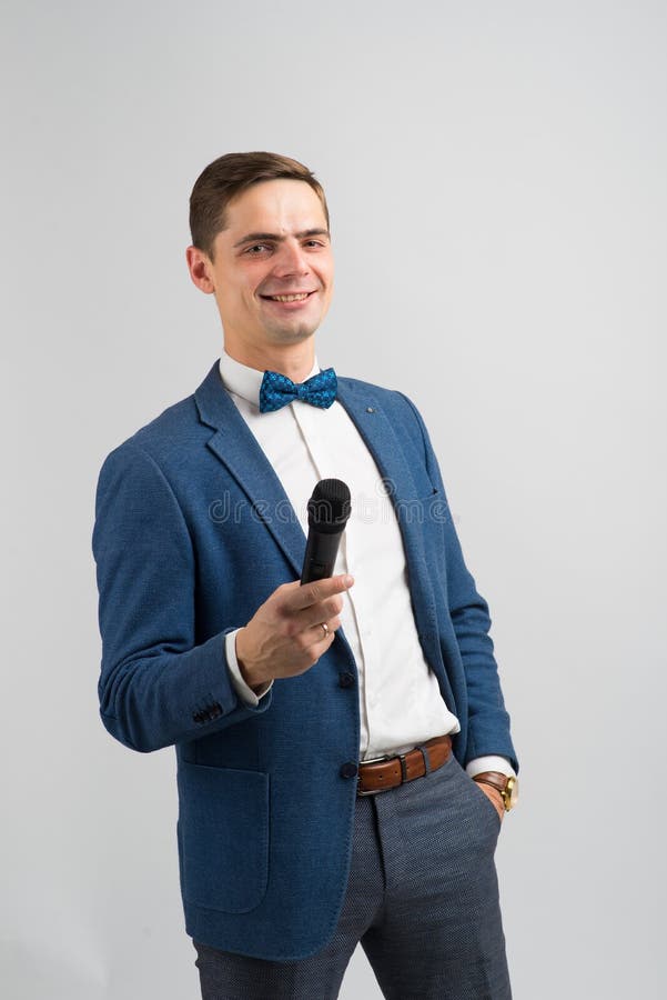 The Entertainer. Young Elegant Talking Man Holding Microphone, Isolated ...