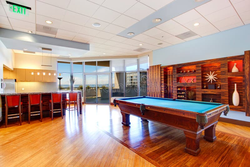 Entertainment Room with Pool Table and Walkout Deck Stock Image - Image ...