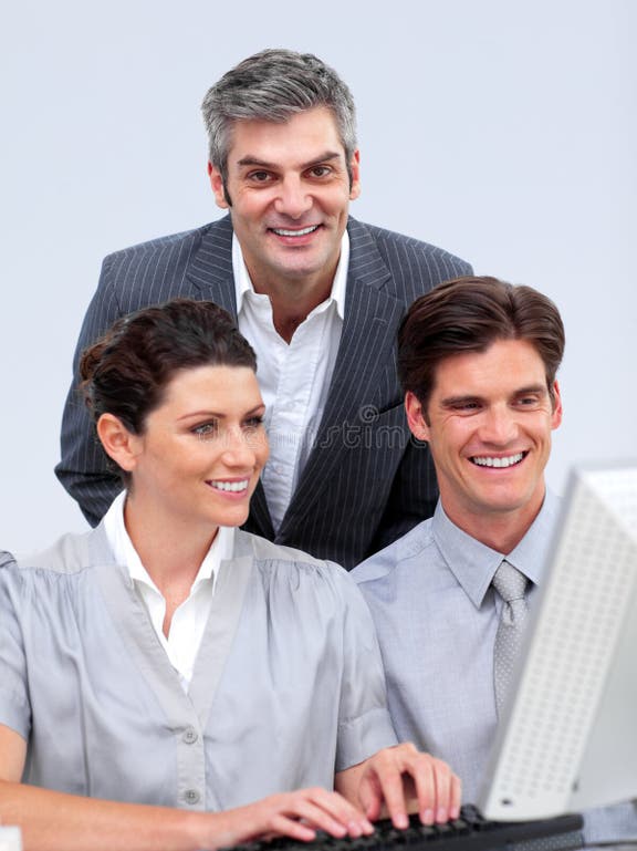 Enthusiastic Business Team Working at a Computer Stock Photo - Image of ...