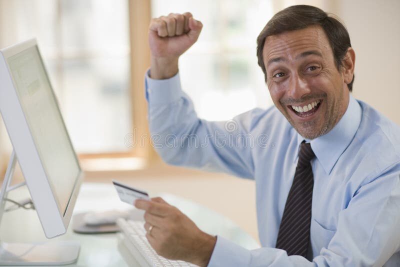 Enthusiastic Man Using Credit Card and Computer Stock Image - Image of ...