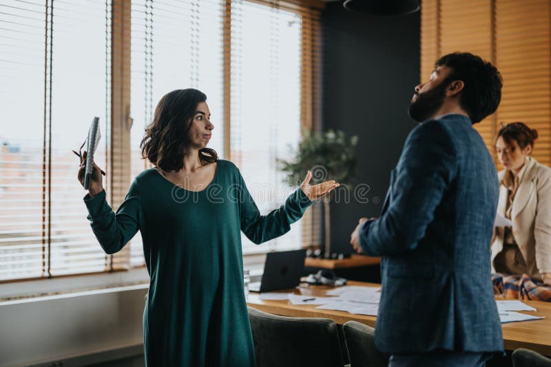 Creative Team Engaging in Lively Discussion during Office Meeting Stock ...