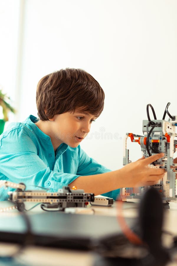 Enthusiastic Schoolboy Building Figures with Construction Set. Stock ...