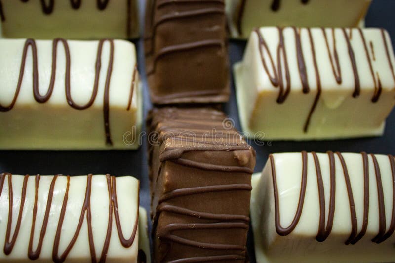 Assortment of White and Dark Chocolate in Unique Shapes Stock Photo ...