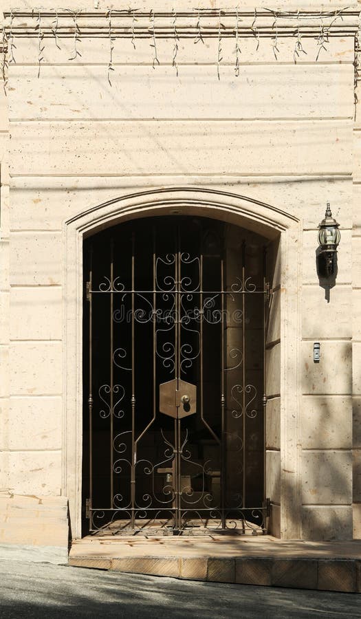 Entrance of Building with Beautiful Old Black Gates Stock Photo - Image ...