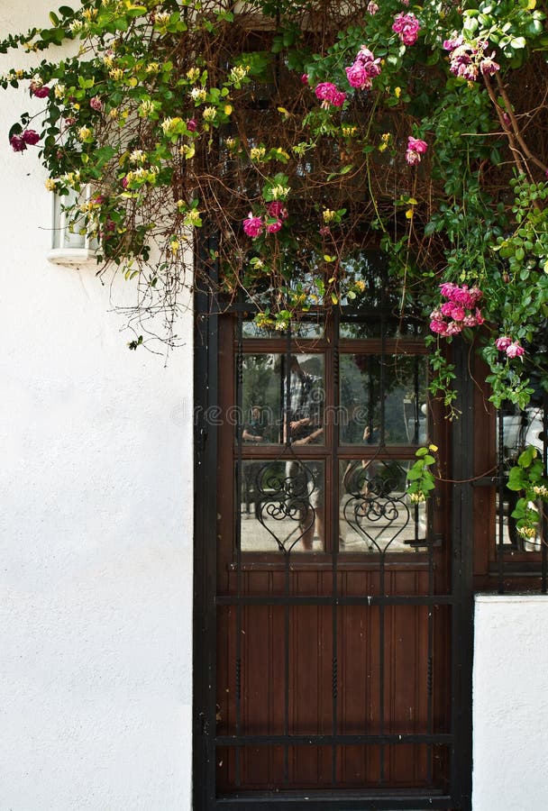 Roses around the door stock photo. Image of decorative - 95038418