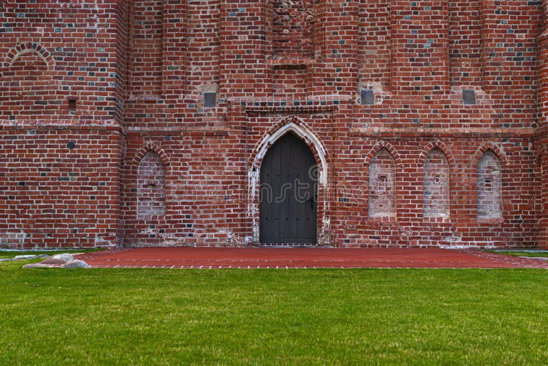 Entrance in Old Gothic Style Red Brick Structure. Stock Image - Image ...