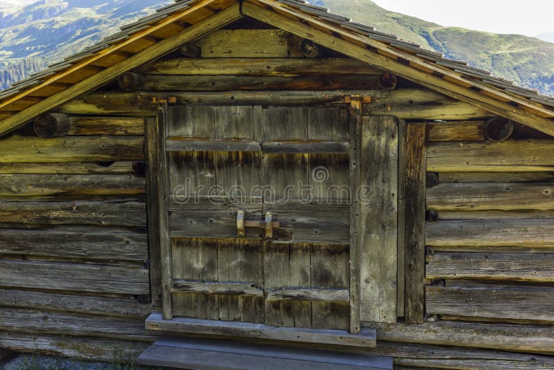 The Entrance of an Old Log Stable on the Alpine Meadows in Switzerland ...