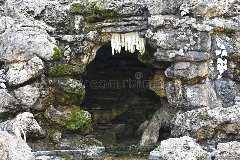 Entrance to a stone cave stock image. Image of adventure - 200214379
