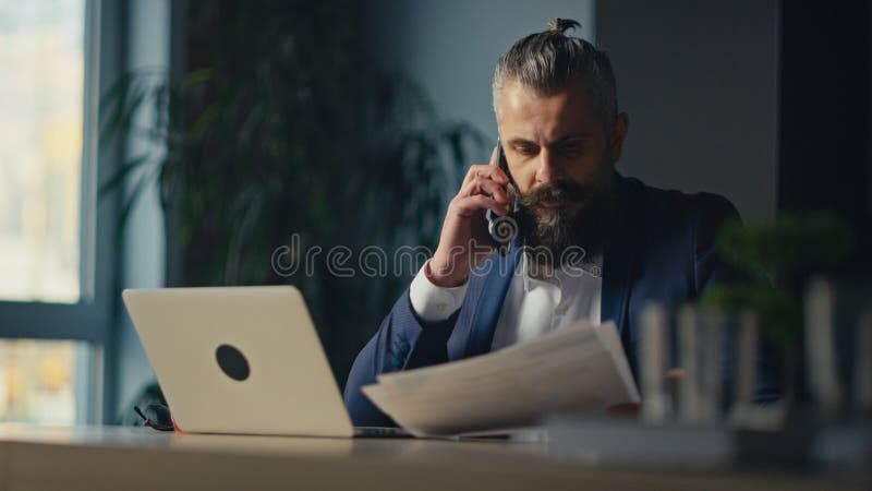 Professional Man Working Office Using Phone Laptop Reviewing Documents ...