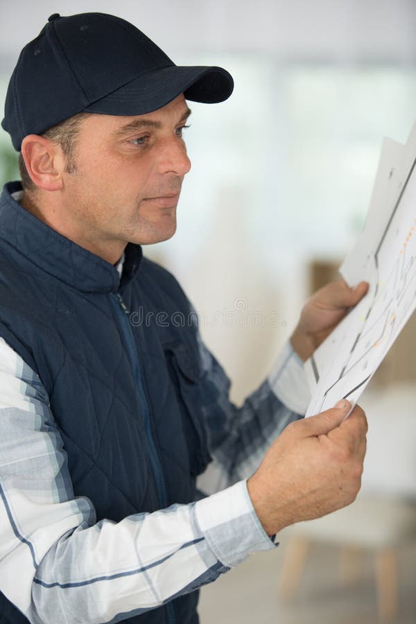 Entrepreneur in House Under Construction Checking Plan Stock Photo ...