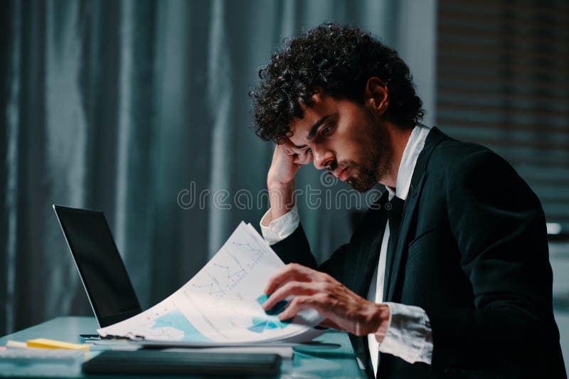 Entrepreneur Looking through Reports Stock Image - Image of page ...