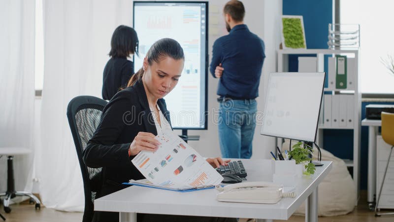 Entrepreneur Working with Computer and Documents for Project Stock ...