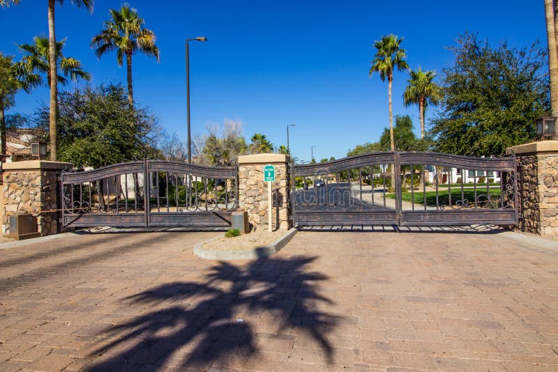 Entry and Exit Gates Framed by Palm Trees Stock Image - Image of metal ...