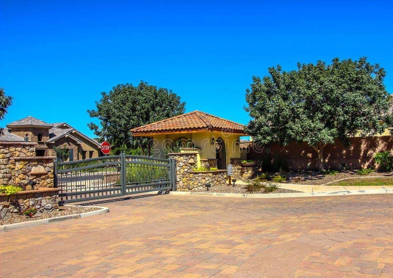 Entry Gate To Secure Subdivision Stock Photo - Image of green, shrubs ...