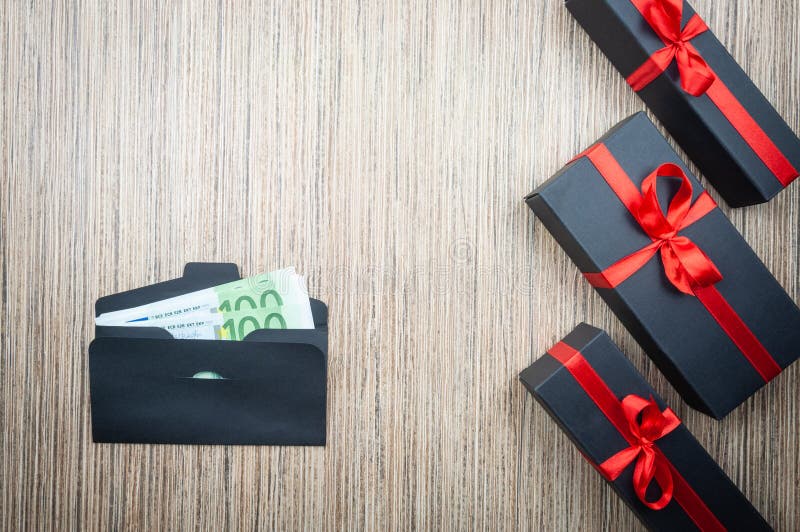 Envelope with Euro Money and Three Gift on Wooden Table. Difficult ...