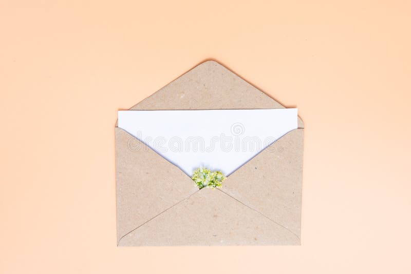 Envelope with White Paper Piece As Note with Tiny Blooming Flowers ...