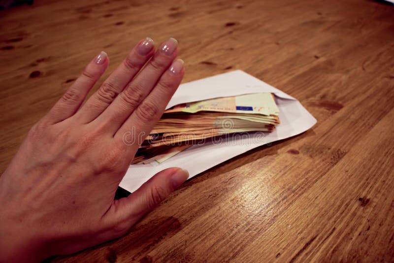 Woman Hand Refusing or Denying an Anvelope with Money. Refusing a Bribe ...