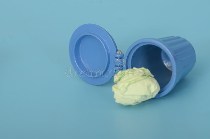 Environmental Concern: Paper Trash Scattered Around an Overflowing Bin ...