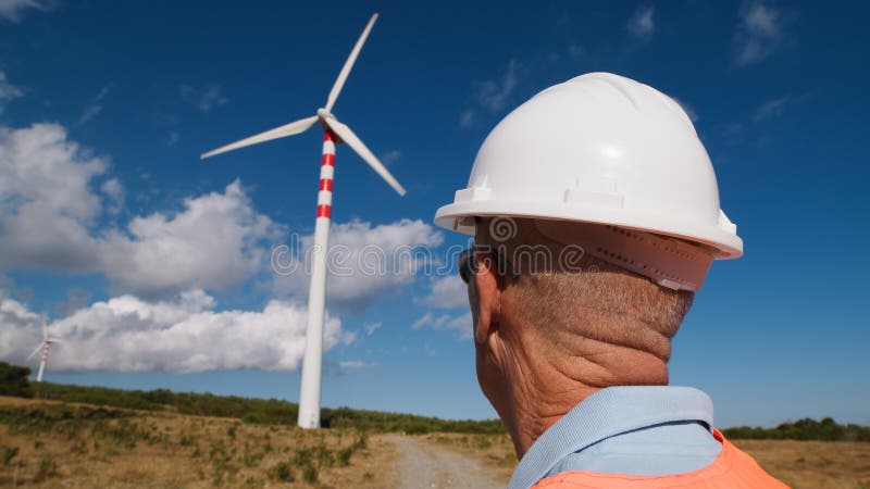 Environmental Engineer Watching the Functioning of a Wind Turbine Stock ...