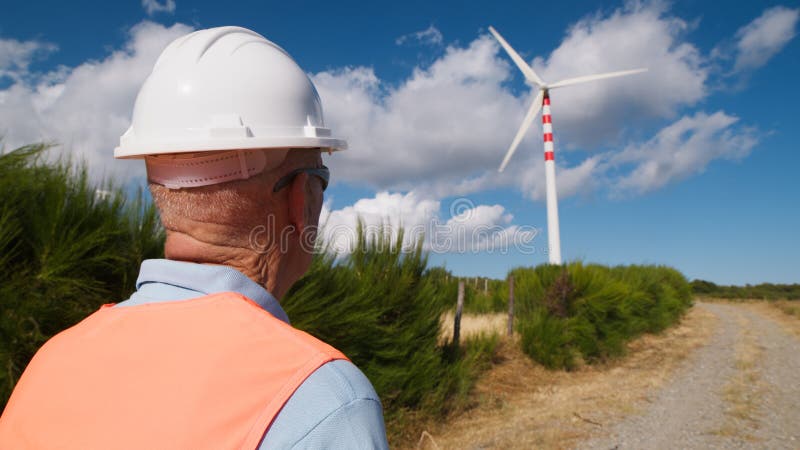 Environmental Engineer Watching the Functioning of a Wind Turbine Stock ...