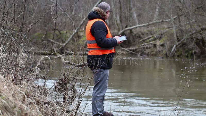 Environmental Inspector Checks the River Pollution in Early Spring ...