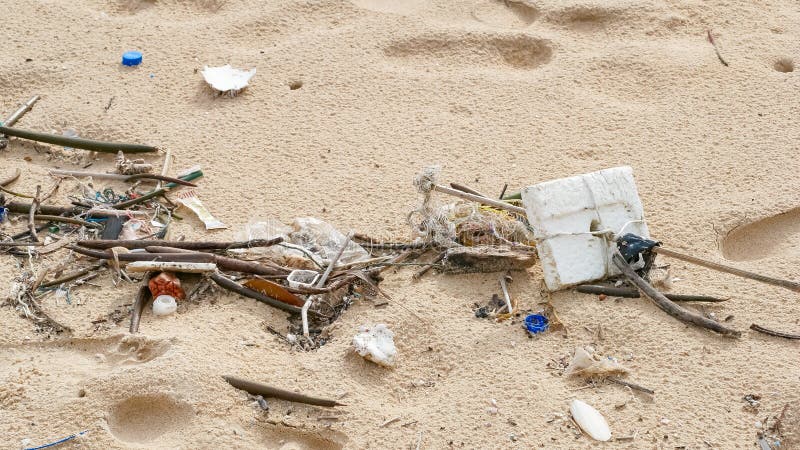 Garbage on sand beach stock photo. Image of rubbish - 187480958