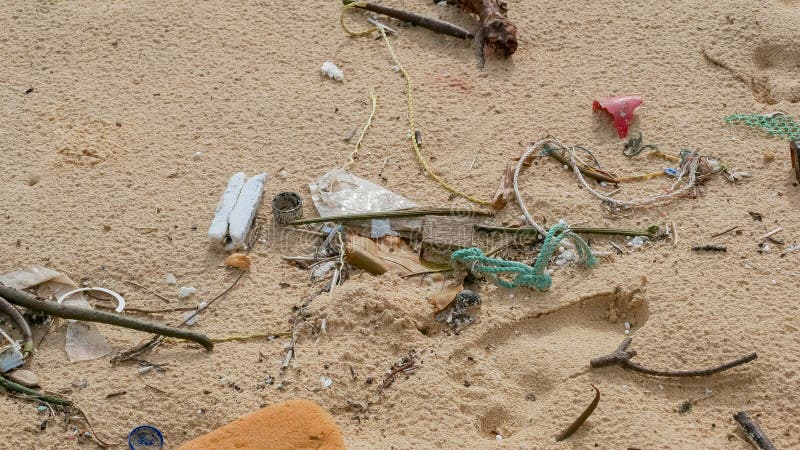 Garbage on sand beach stock photo. Image of stack, sand - 187481262