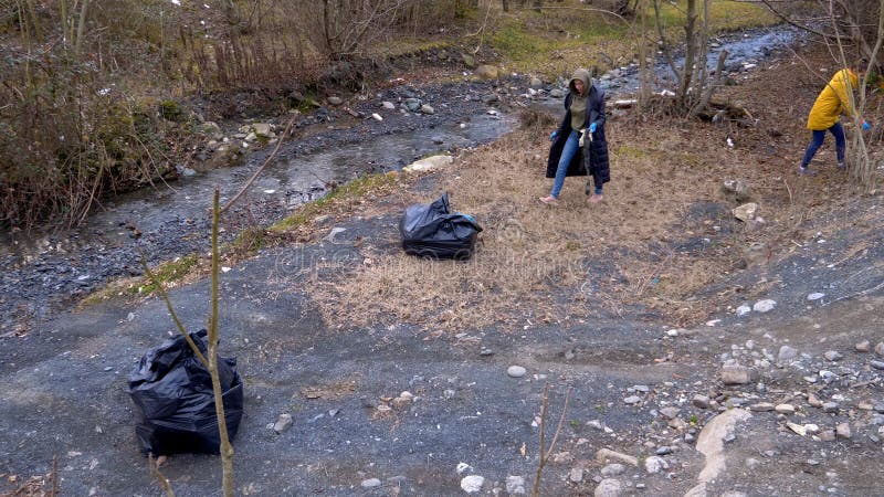 Environmental Problems. Volunteers Collect Trash on the Banks of the ...