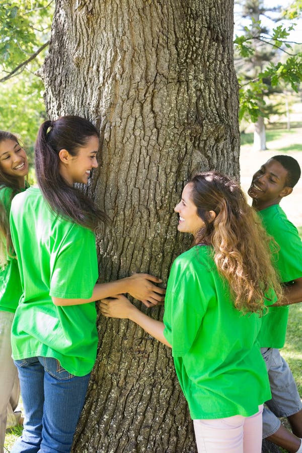 Environmentalists Standing Around Tree Trunk Stock Photo - Image of ...