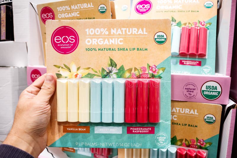 EOS lip balm editorial image. Image of hand, shop, holds - 176958855