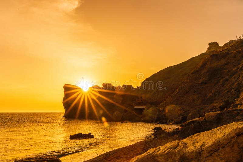 An Epic Sunset on the Sea - the Sun Sets Behind the Mountain and ...