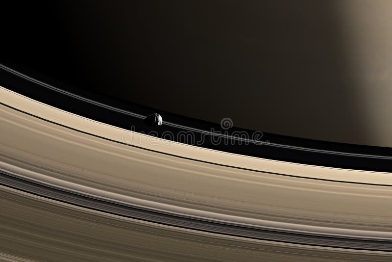 Epimetheus, Inner Satellite of Saturn, Orbiting in the Saturn Rings. 3d ...
