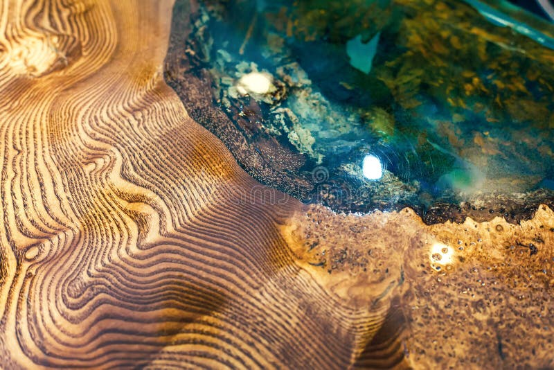 Epoxy Resin Table with Transparent Inserts and Wooden Base Stock Image ...