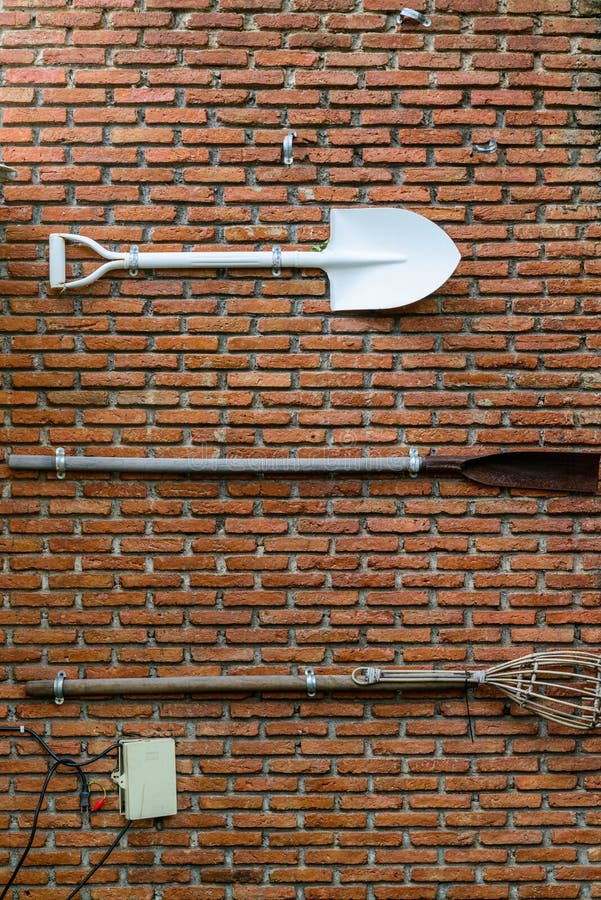 Equipment Attached To a Brick Wall Stock Photo - Image of paint ...