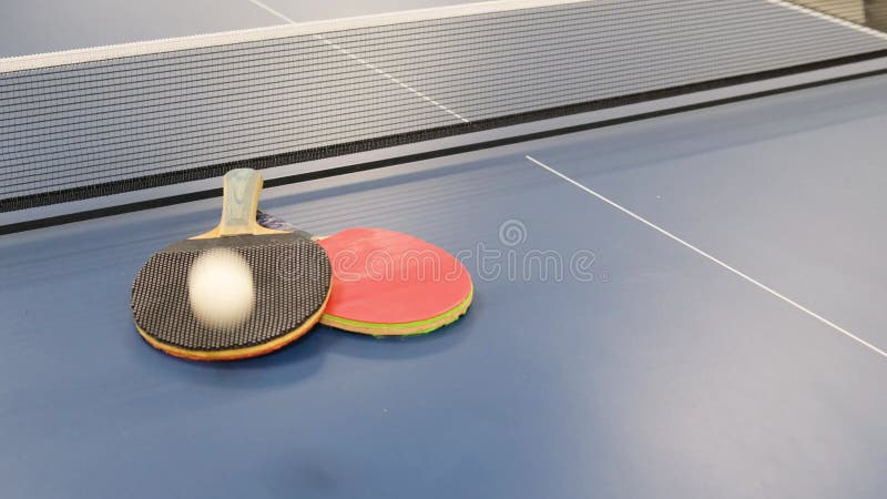 Rackets and Ball on a Blue Table for Table Tennis. Ping-pong Stock ... Rackets and Ball on a Blue Table for Table Tennis. Ping-pong Stock ...