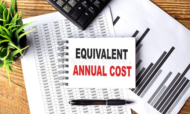 EQUIVALENT ANNUAL COST Text on a Notebook with Chart and Calculator ...