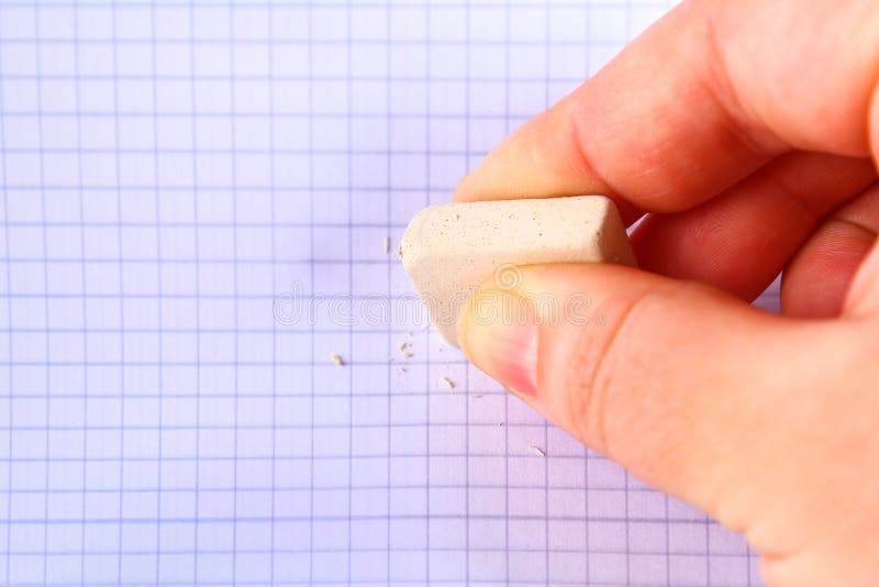 Eraser in Hand Erasing on a Sheet in a Cage. Stock Image - Image of ...