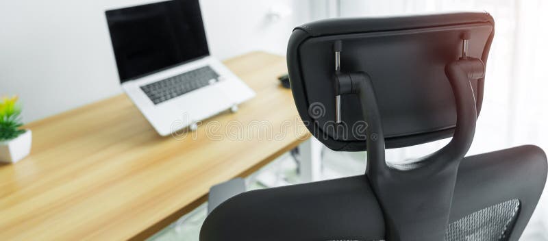 Ergonomic Chair and Adjustable Table with Laptop Computer in Modern ...