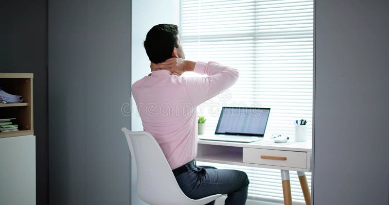 Ergonomic Chair and Adjustable Table with Laptop Computer in Modern ...