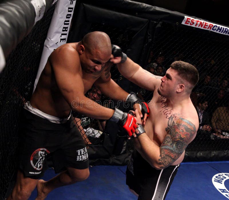 Eric Bedard Lands a Punch To the Head. Editorial Photo - Image of head, cage: 23101016